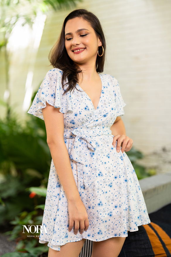 Buy elegant blue floral printed waist tie up flared dress at Nora Reed